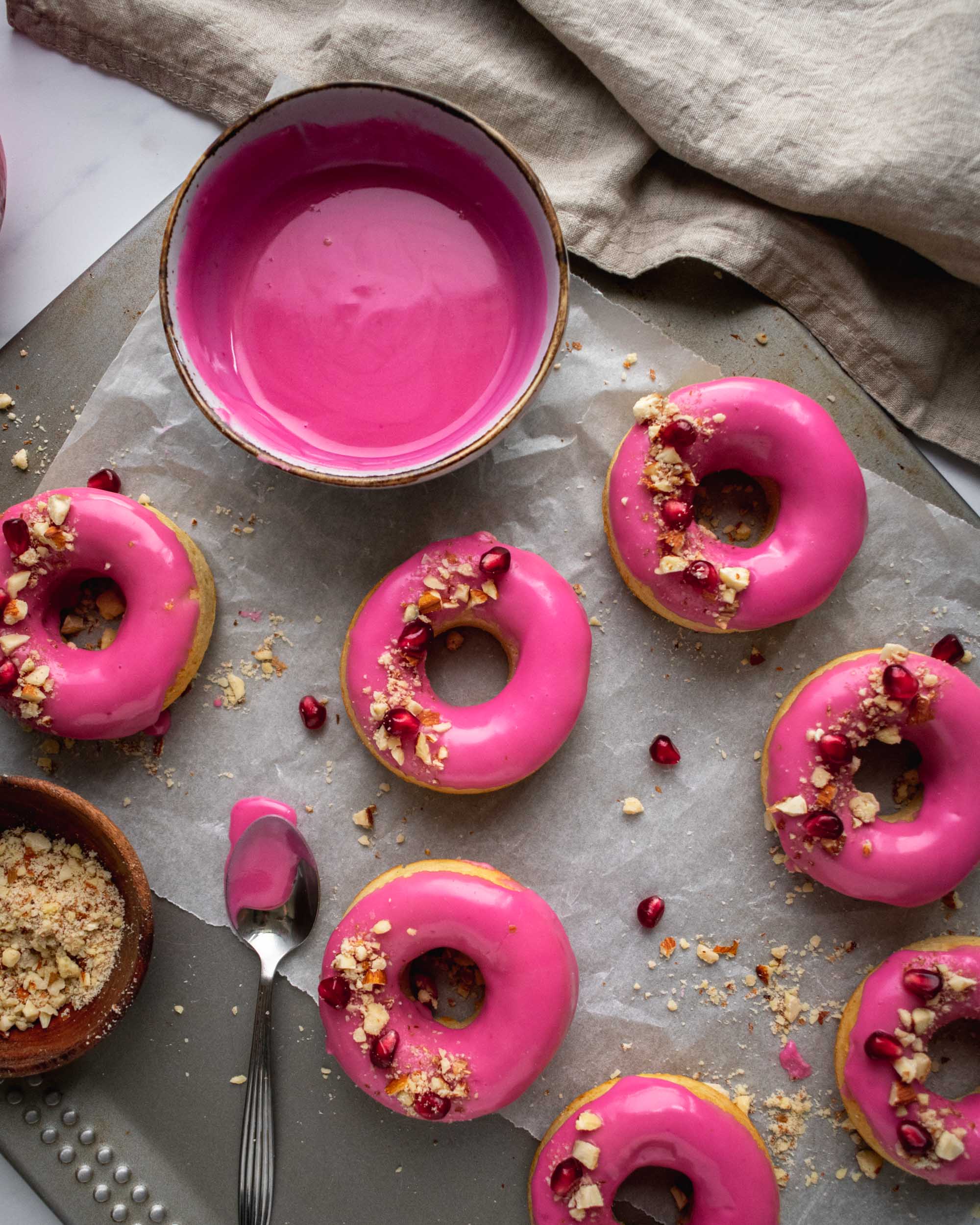 Almond baked doughnuts with a pomegranate glaze | Apron & Whisk