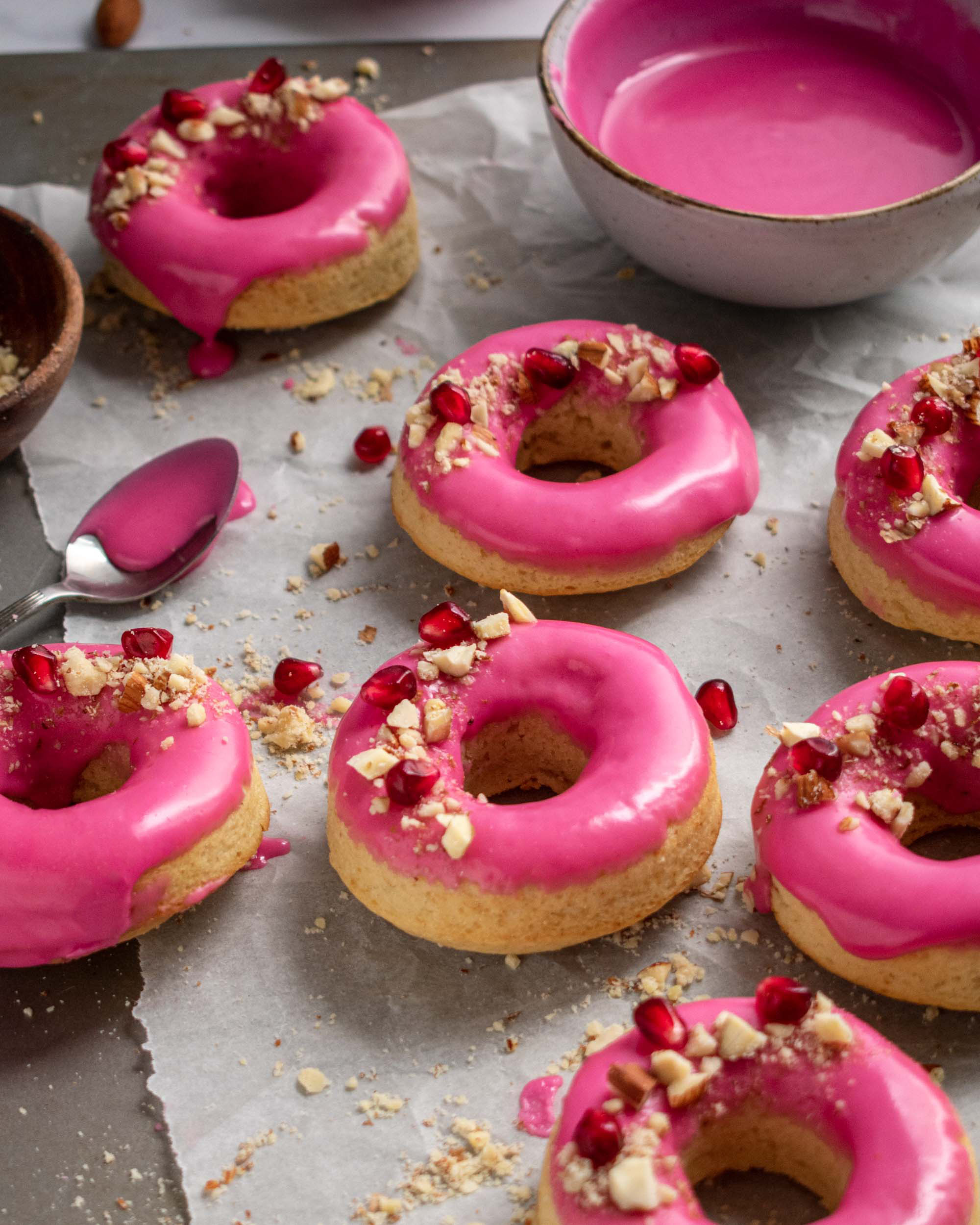 Almond baked doughnuts with a pomegranate glaze | Apron & Whisk