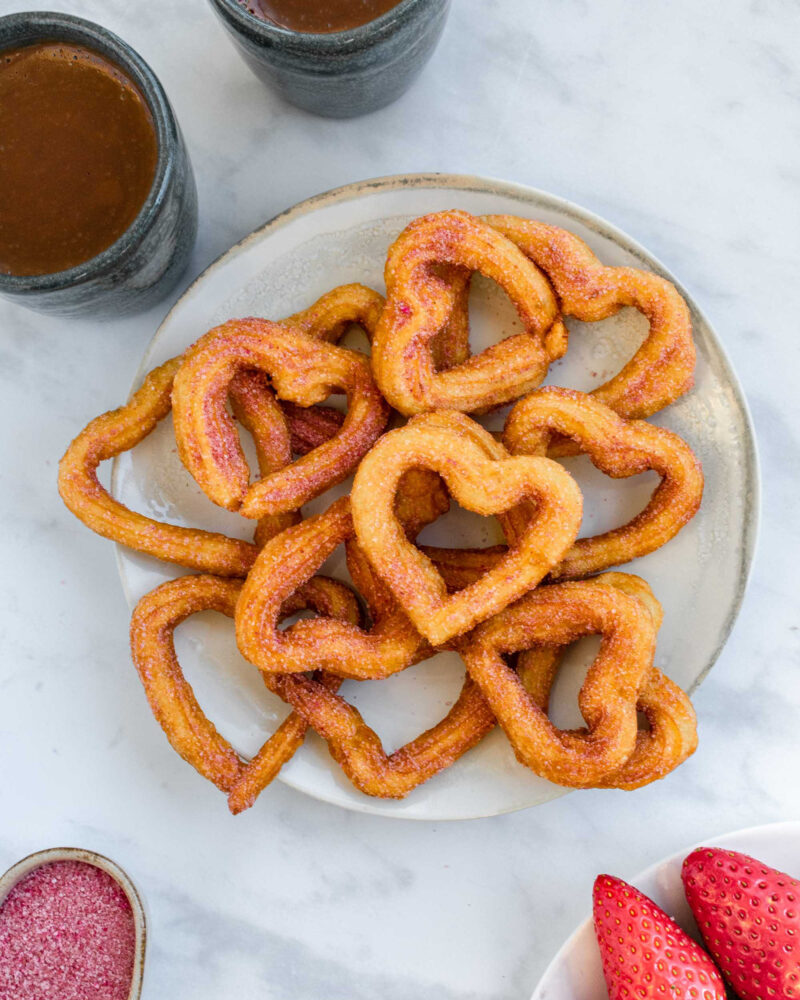 Heart-Shaped Churros with a thick chocolate sauce - Apron & Whisk
