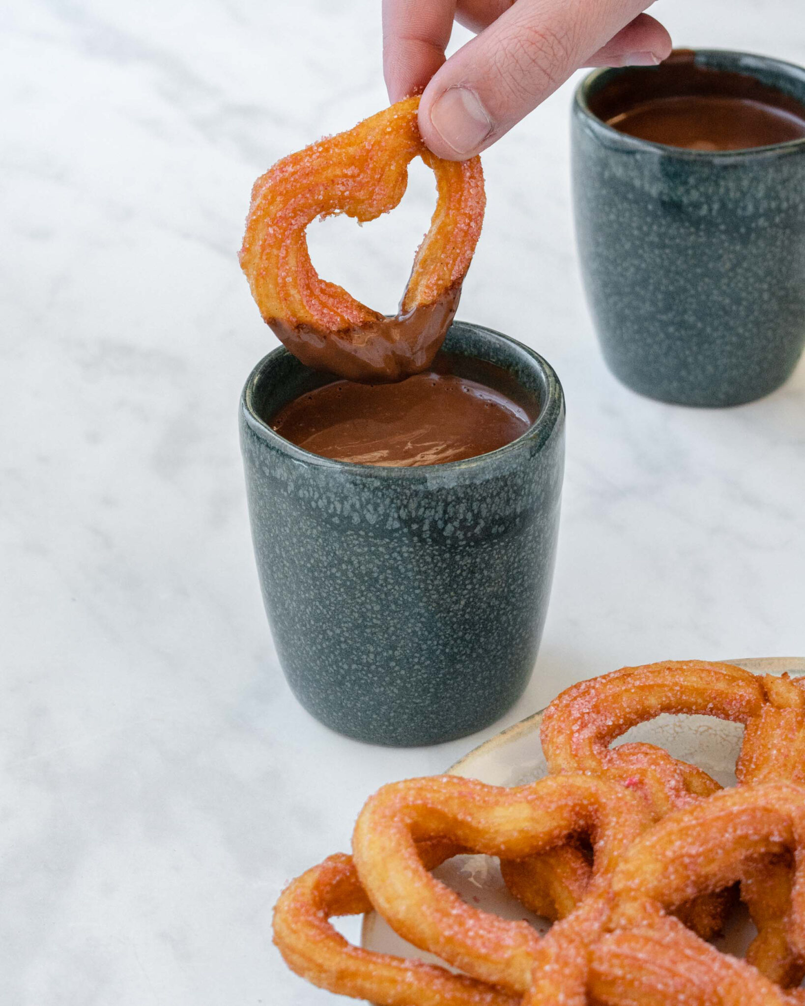 Heart-Shaped Churros with a thick chocolate sauce - Apron & Whisk